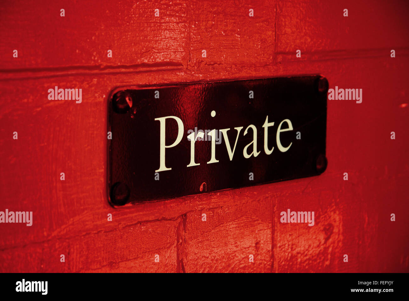 Private sign on red door - angled Stock Photo - Alamy