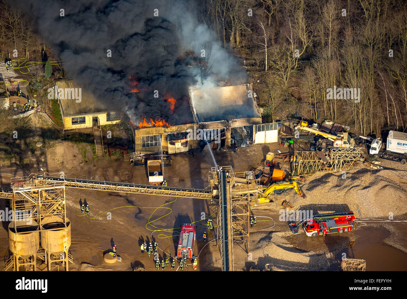 Aerial view, a warehouse fire of Terra-gravel plant on Pulheimer lake ...