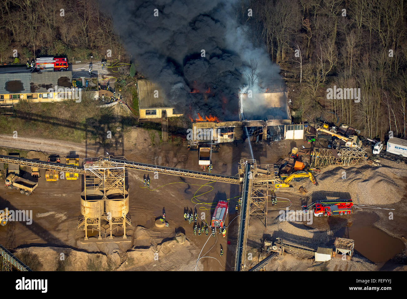 Aerial view, a warehouse fire of Terra-gravel plant on Pulheimer lake ...