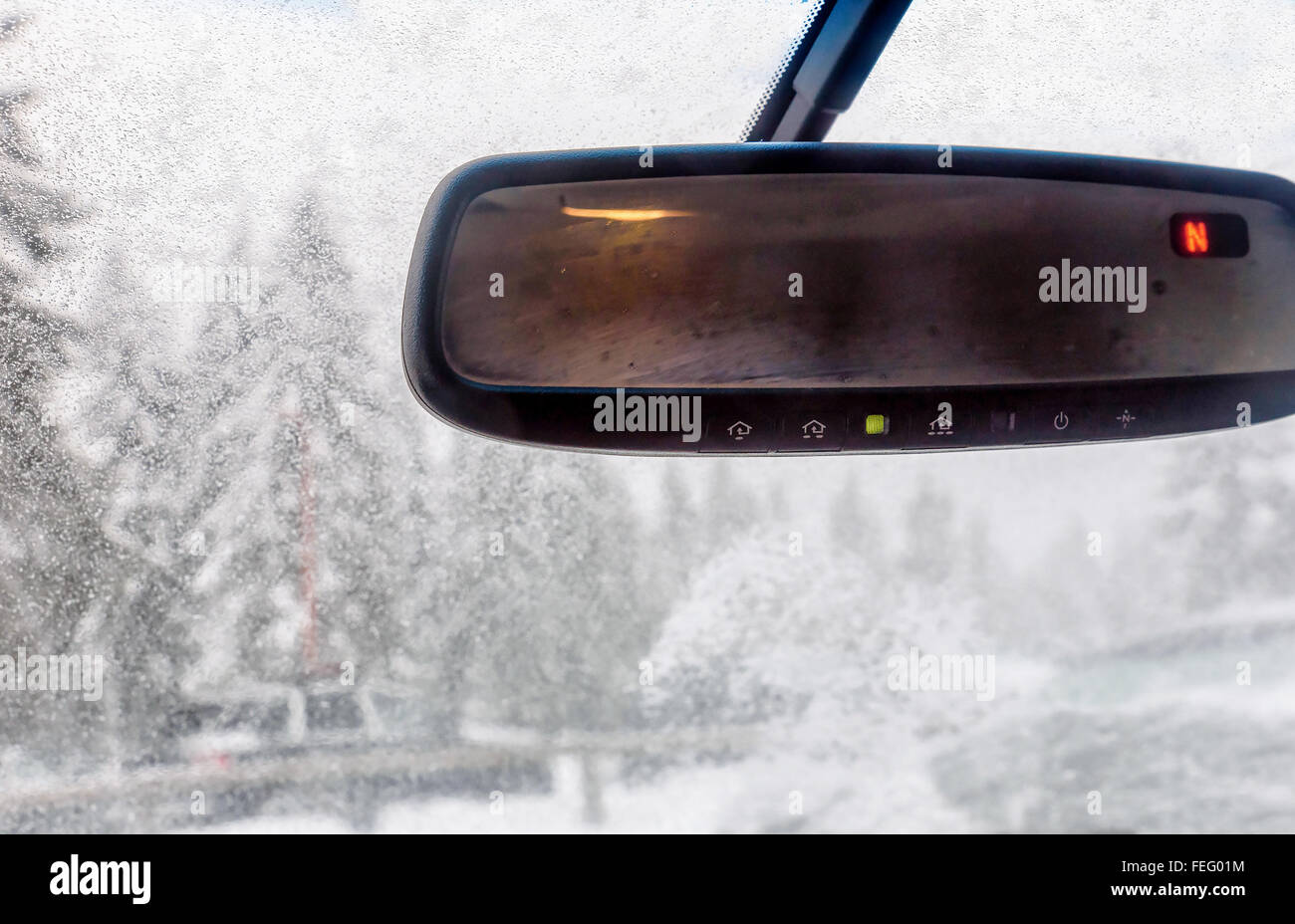 View through the cars windshield in the winter snowy day on the road ...