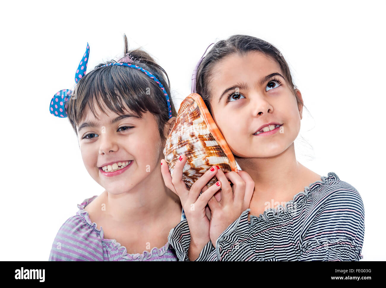 Little girl with seashell hi-res stock photography and images - Alamy