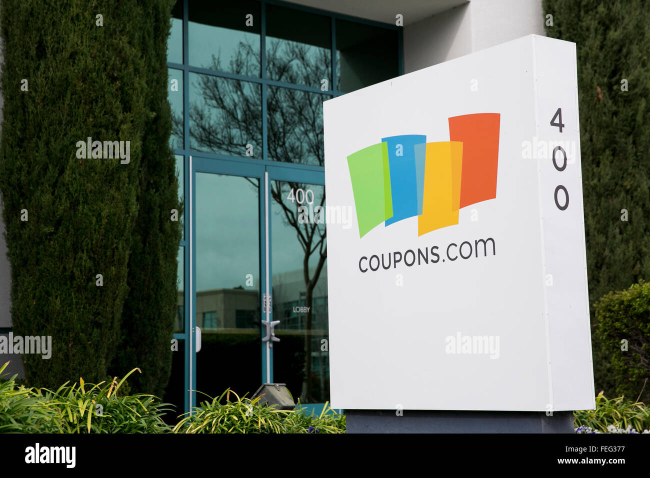 A logo sign outside of the headquarters of Coupons.com in Mountain View ...