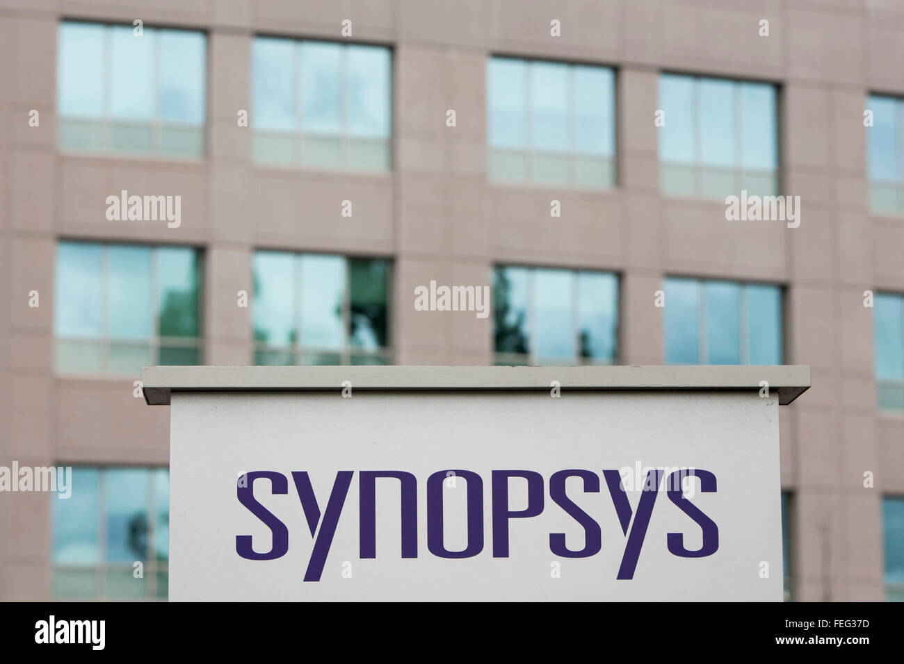 A logo sign outside of the headquarters of Synopsys, Inc., in Mountain ...