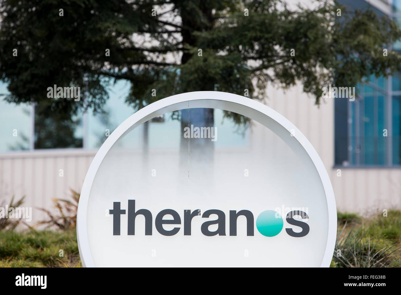 A logo sign outside of the headquarters of Theranos in Palo Alto ...