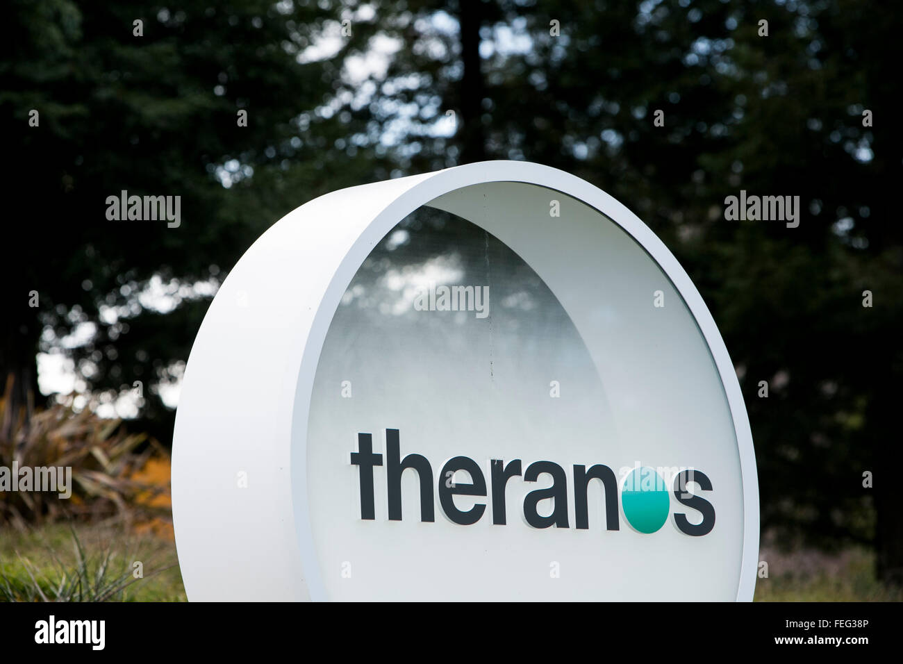 A logo sign outside of the headquarters of Theranos in Palo Alto ...