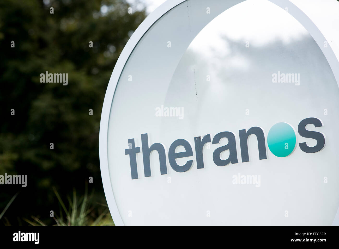 A logo sign outside of the headquarters of Theranos in Palo Alto ...