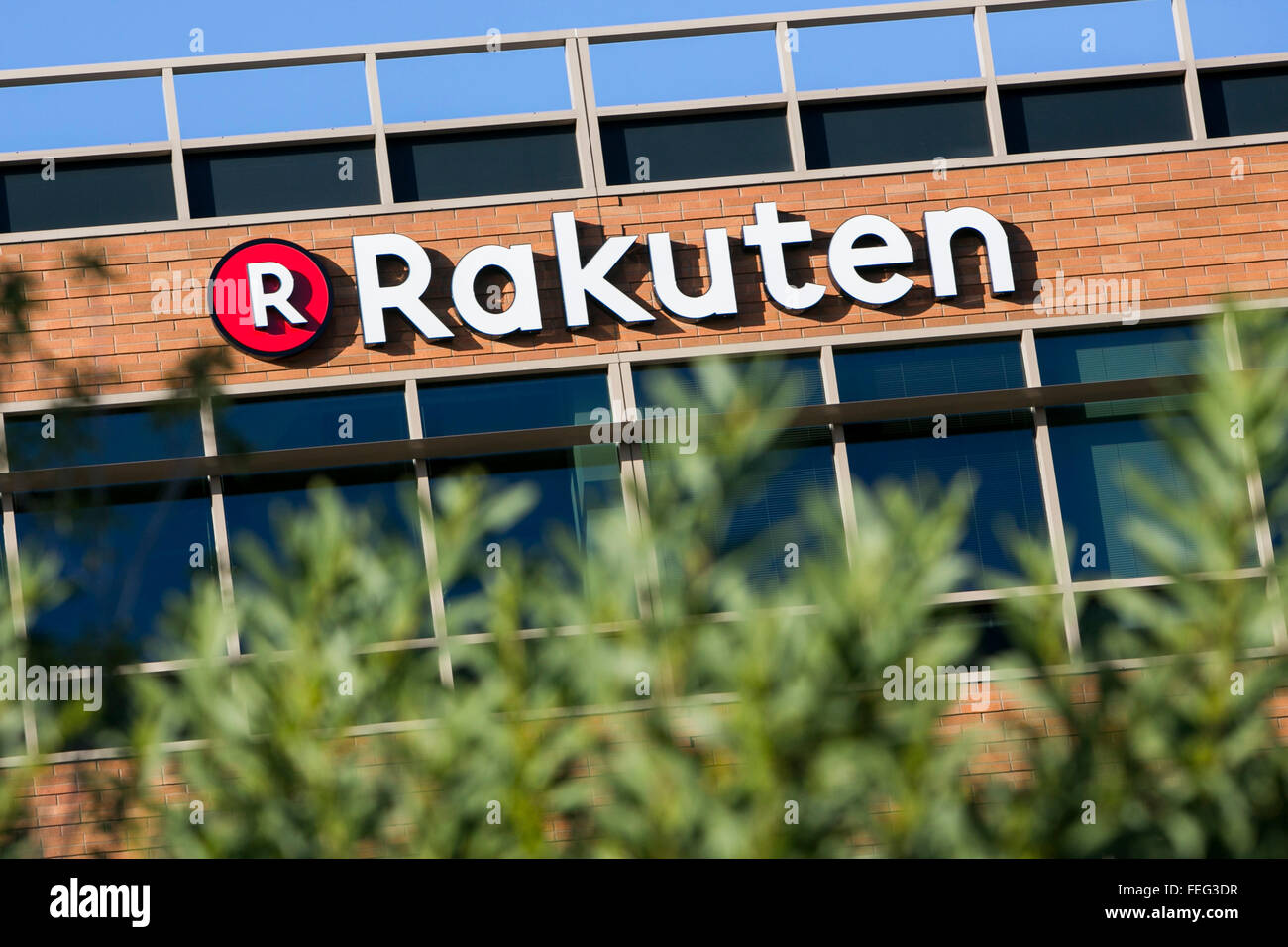 A logo sign outside of facility occupied by Rakuten in San Mateo ...