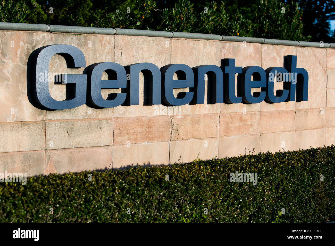 A logo sign outside of the headquarters of Genentech in South San ...
