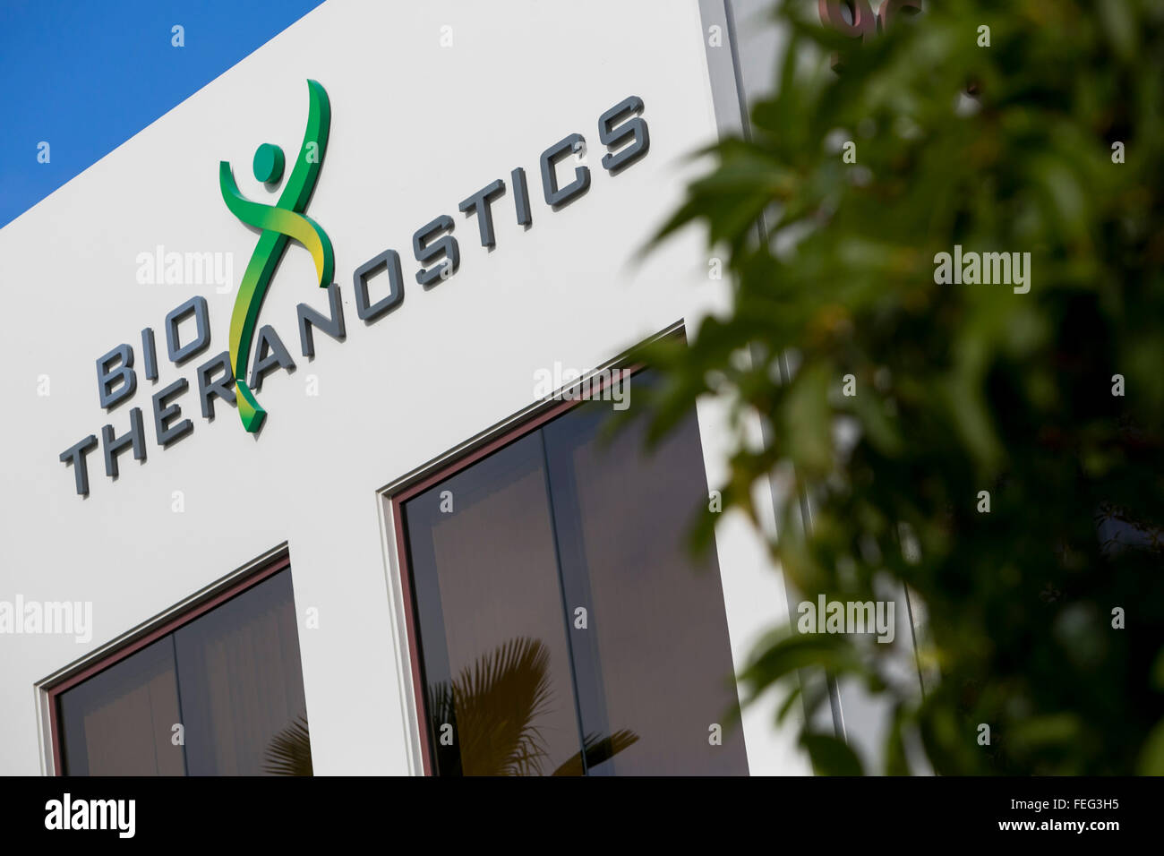 A logo sign outside of the headquarters of BioTheranostics in San Diego ...