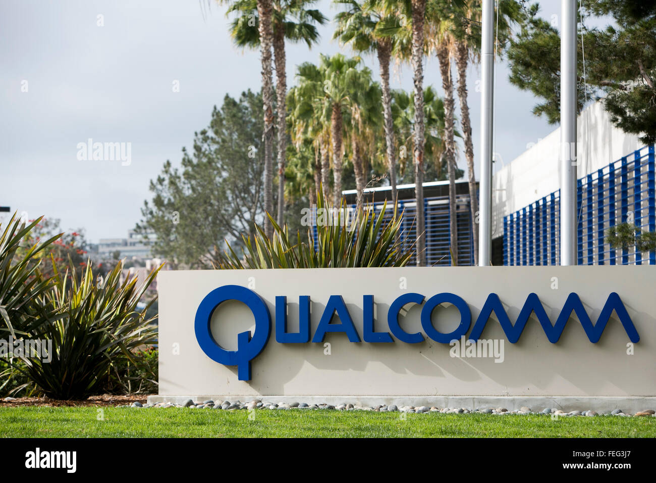 A logo sign outside of a facility occupied by Qualcomm in San Diego ...