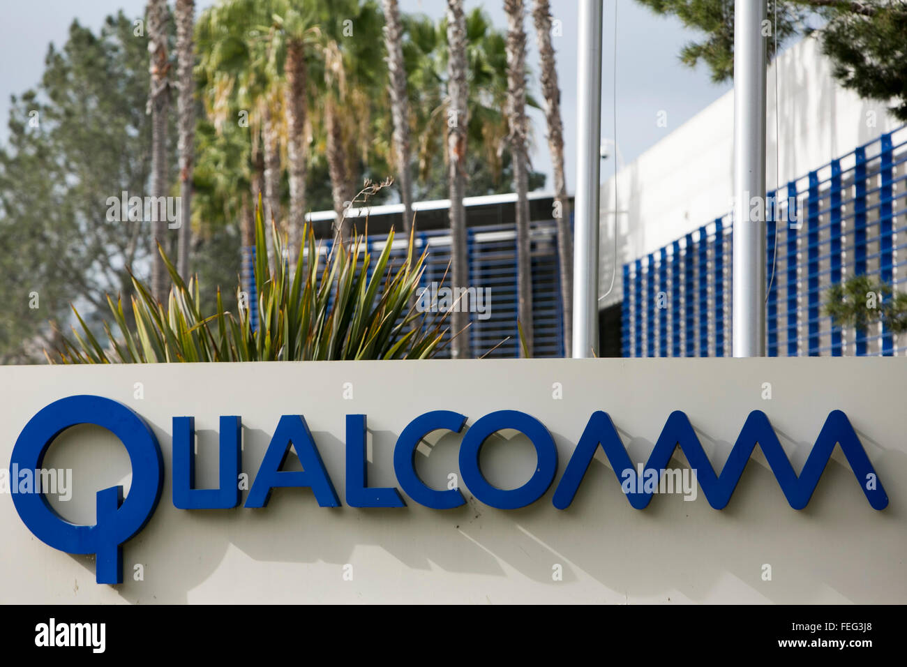 A logo sign outside of a facility occupied by Qualcomm in San Diego ...