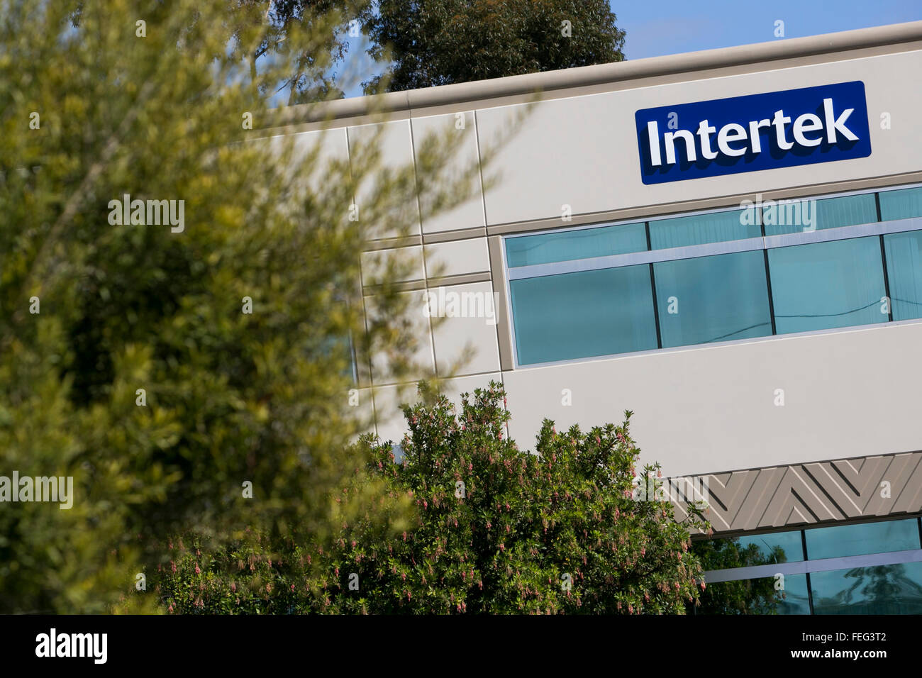 A logo sign outside of a facility occupied by the Intertek Group in San ...