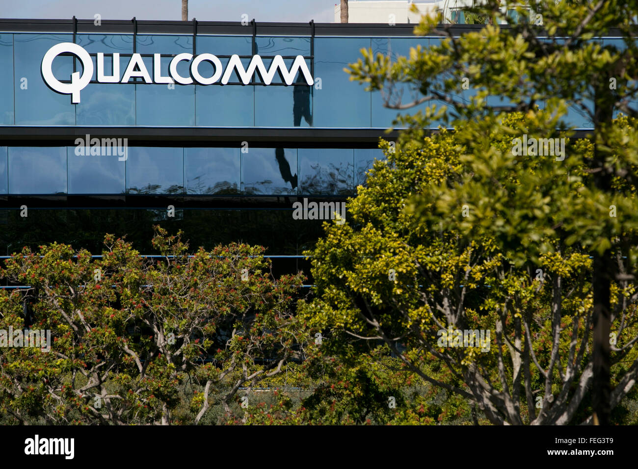 A logo sign outside of a facility occupied by Qualcomm in San Diego ...
