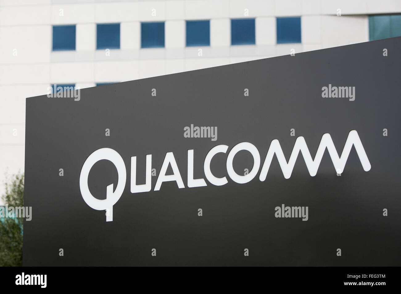 A logo sign outside of a facility occupied by Qualcomm in San Diego ...