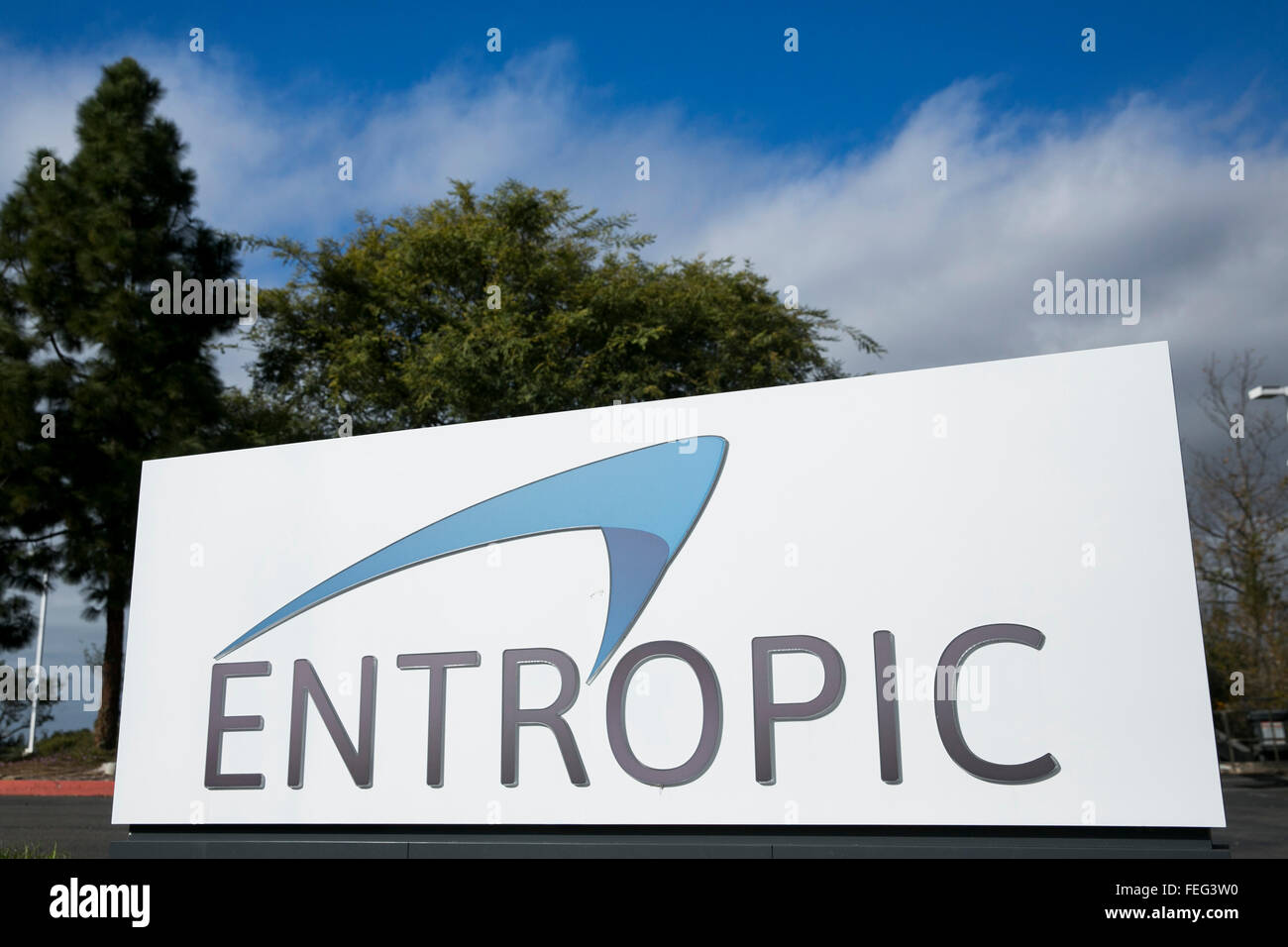 A logo sign outside of a facility occupied by Entropic Communications ...