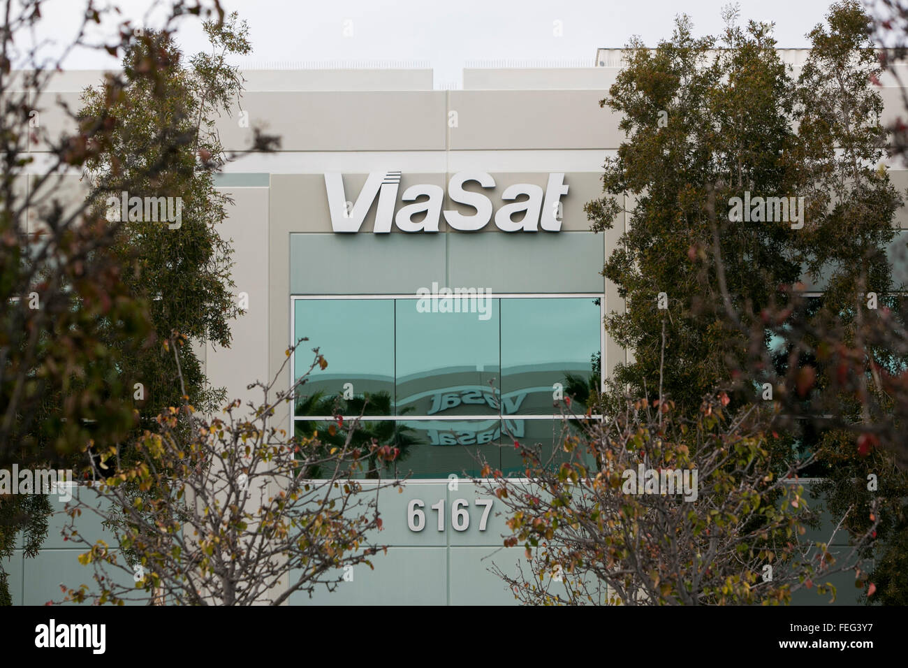 A logo sign outside of the headquarters of ViaSat Inc., in Carlsbad ...