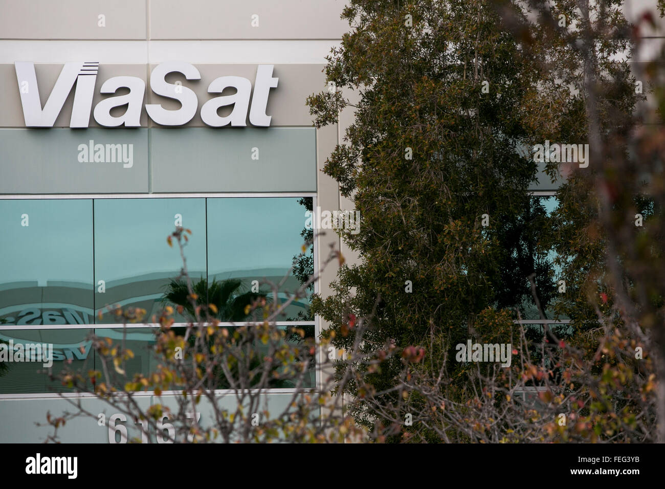 A logo sign outside of the headquarters of ViaSat Inc., in Carlsbad ...