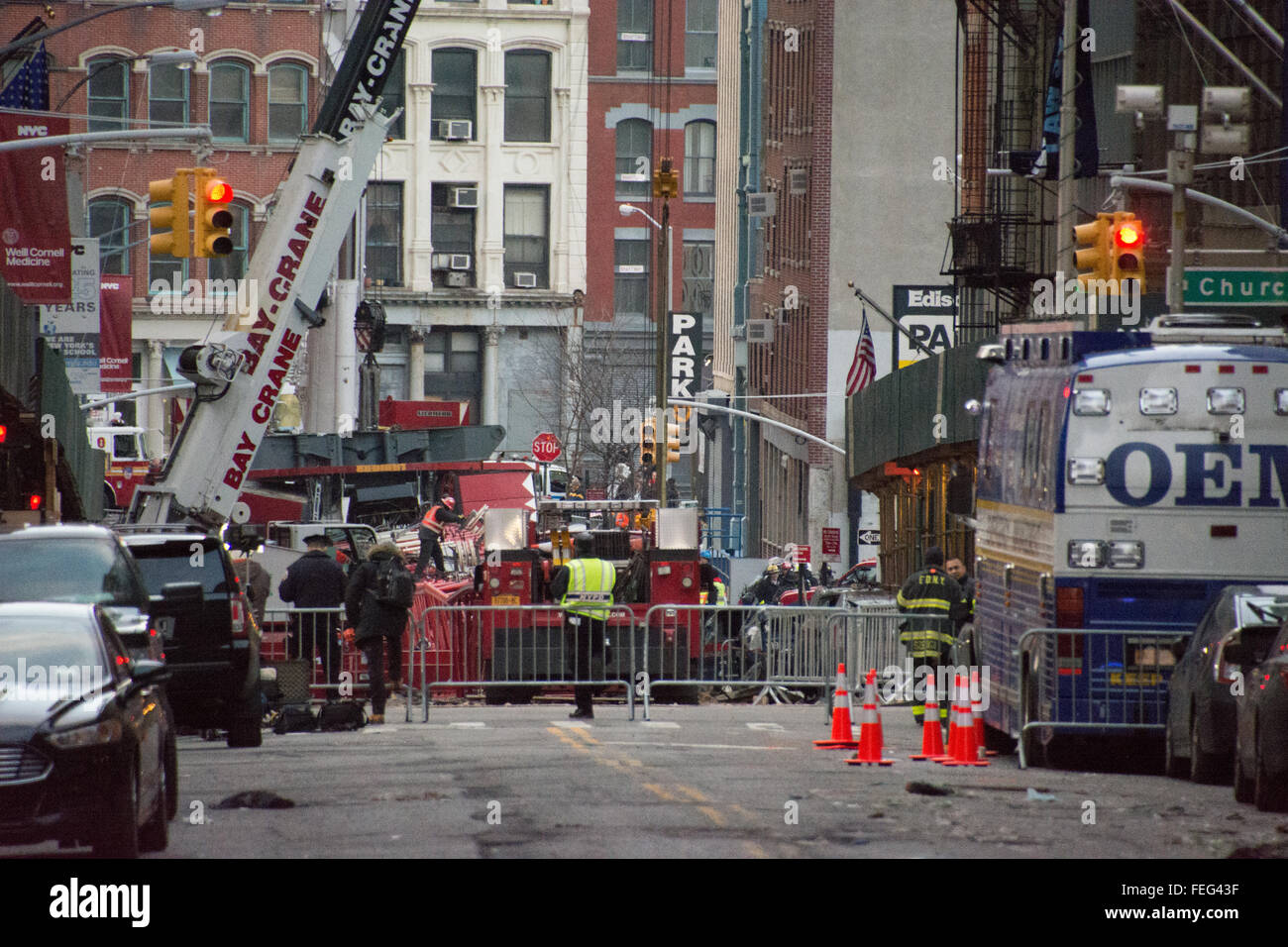 New York, USA. 06th Feb, 2016. Workers dismantle collapsed crane boom ...