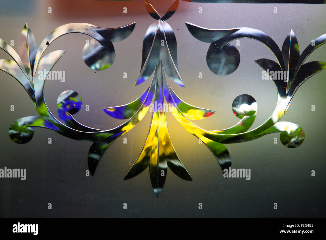 A spring flower window box viewed through an English Pub/bar Victorian ...