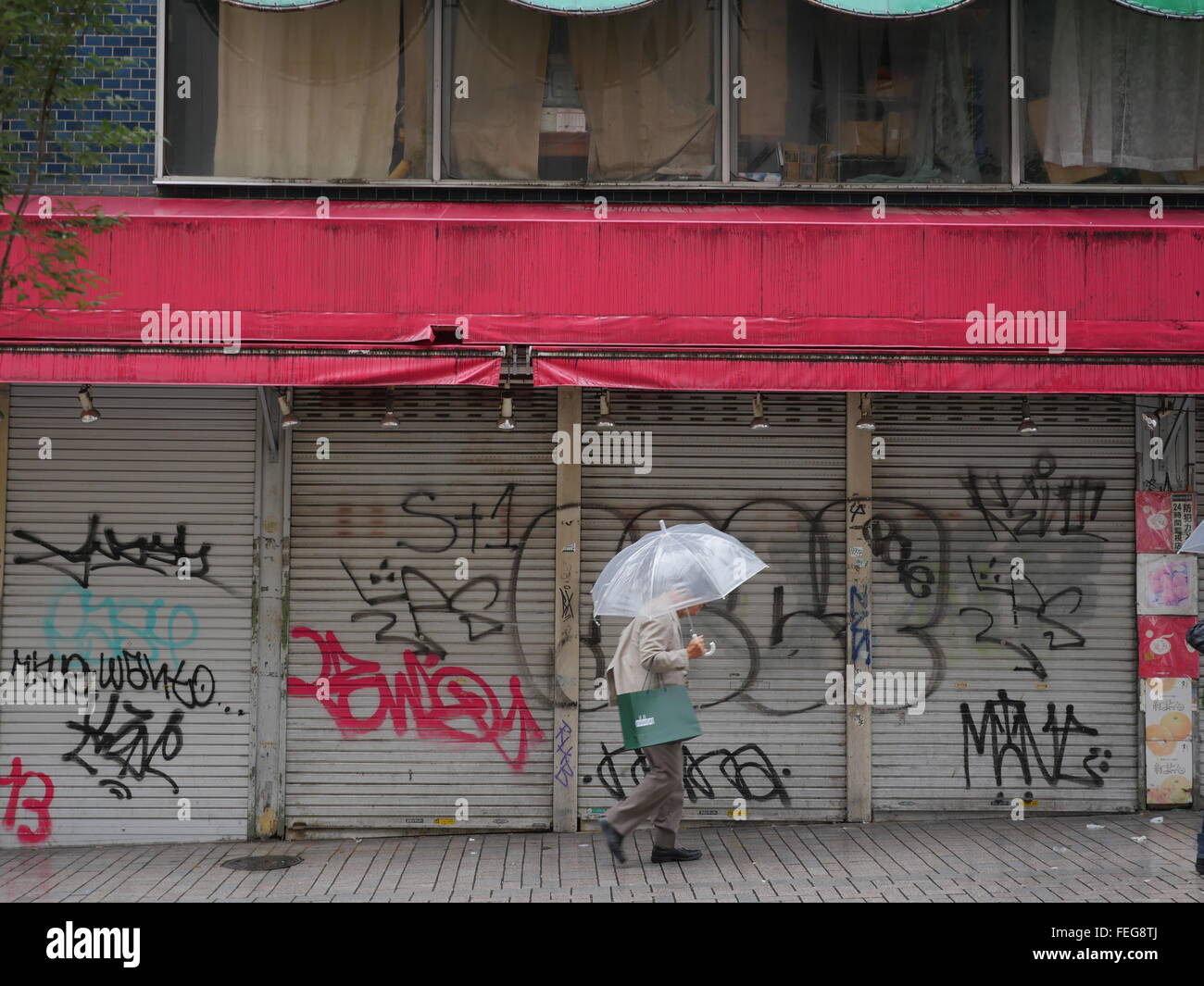 You can't see the writing unless you stop and notice. An old man passes ...