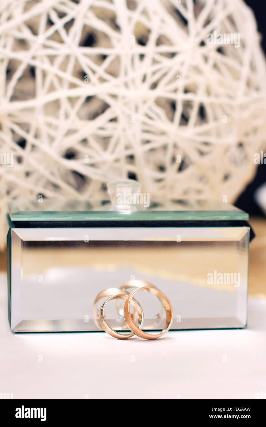 gold wedding rings and mirror casket Stock Photo - Alamy