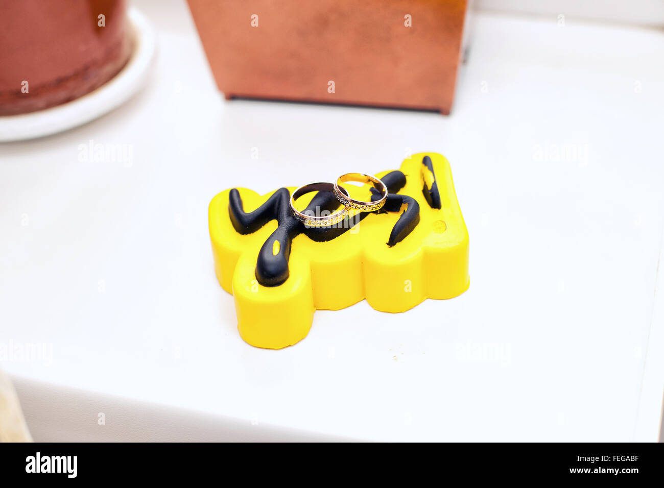 gold wedding rings and inscription yes yellow color Stock Photo - Alamy