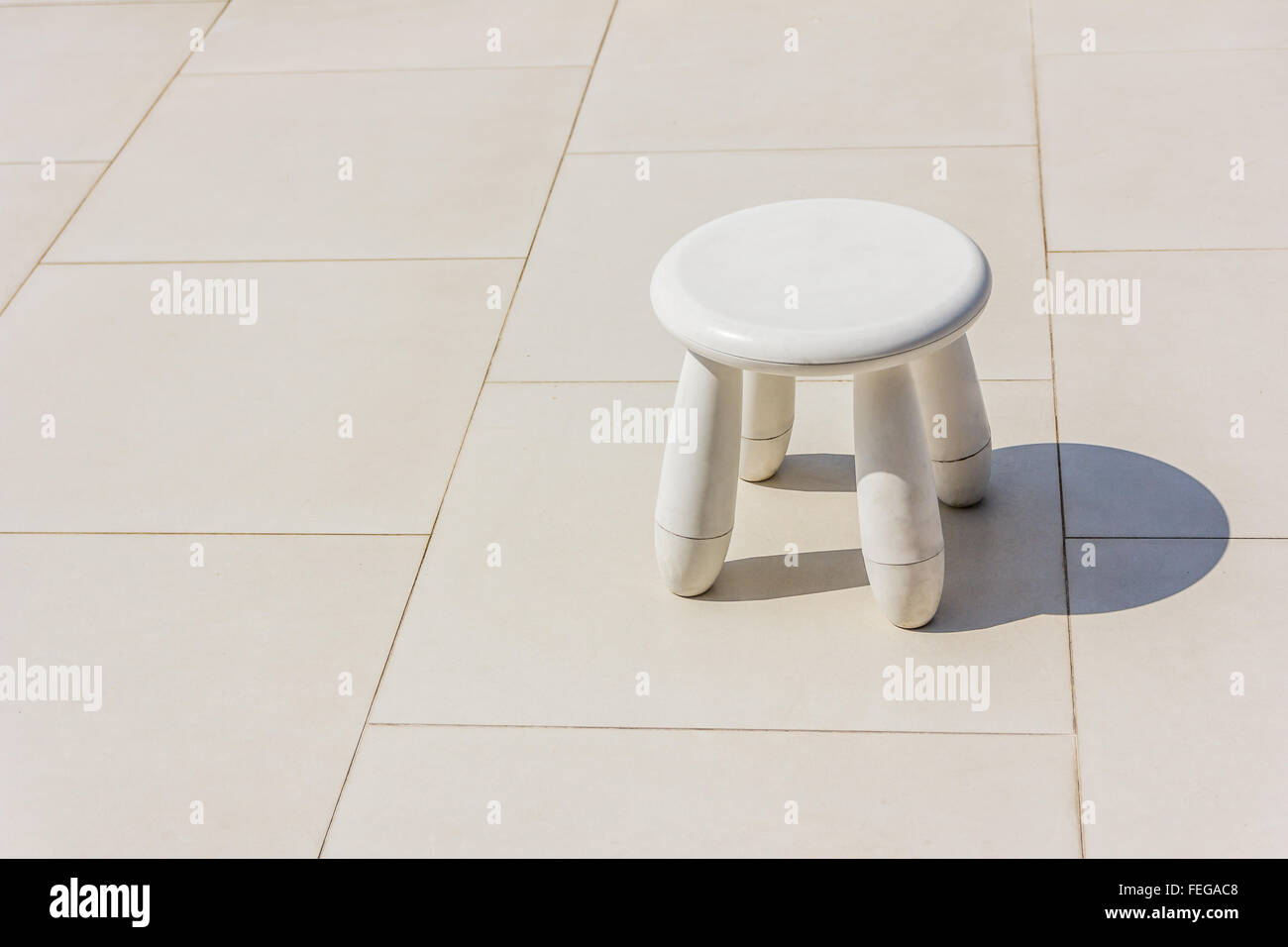Old baby white plastic stool Stock Photo - Alamy