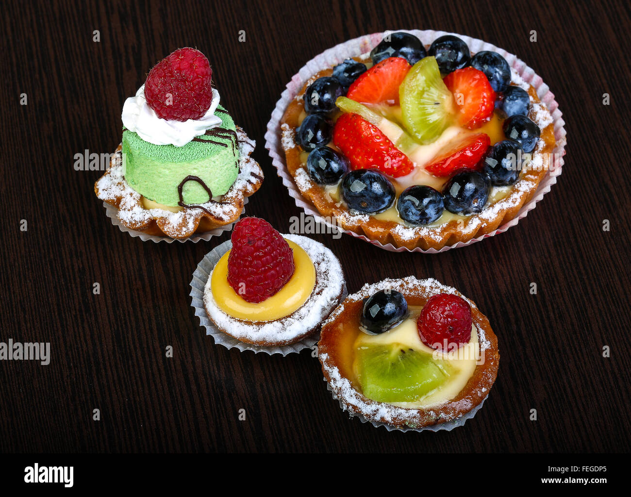 Sweet Pastry with berries on the wood background Stock Photo - Alamy