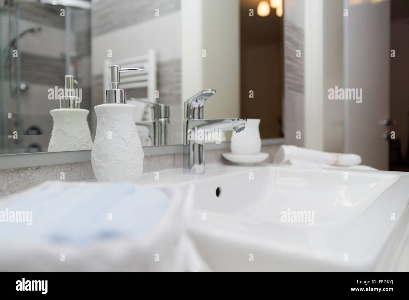 Hotel Bathroom: Sink, Tap, Towels and Bathroom Set. Modern Bathroom ...