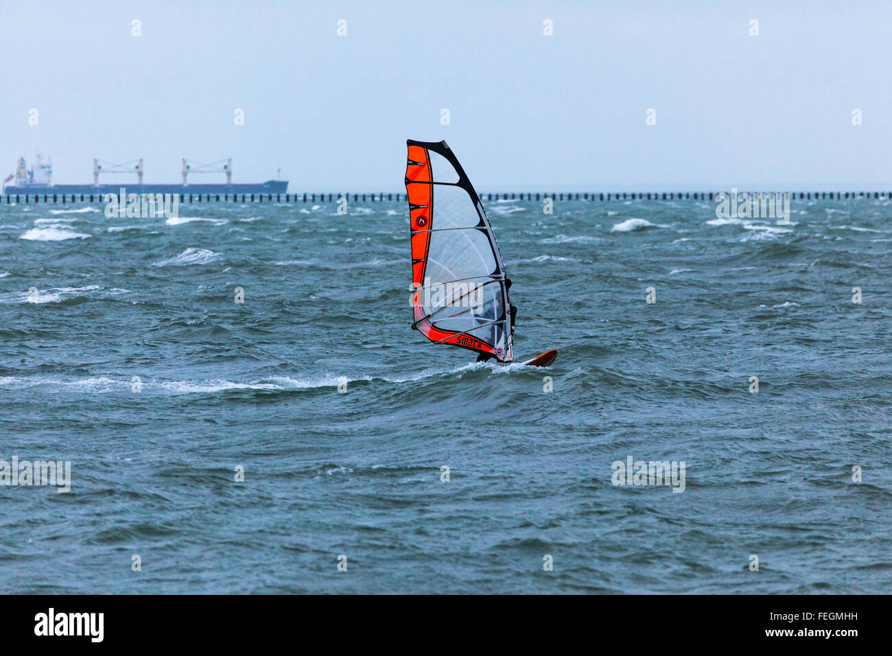 Wind Surfer in Challenging Sea Conditions During Gale with Large Ship ...
