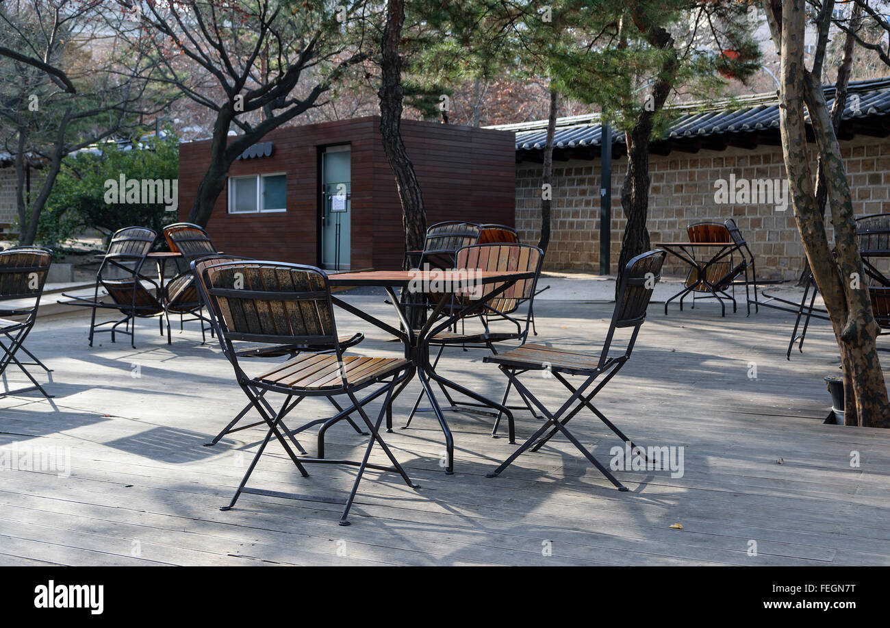 Wood table seating in the park Stock Photo - Alamy