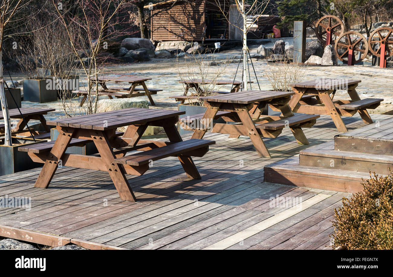 Wood table seating in the park Stock Photo - Alamy
