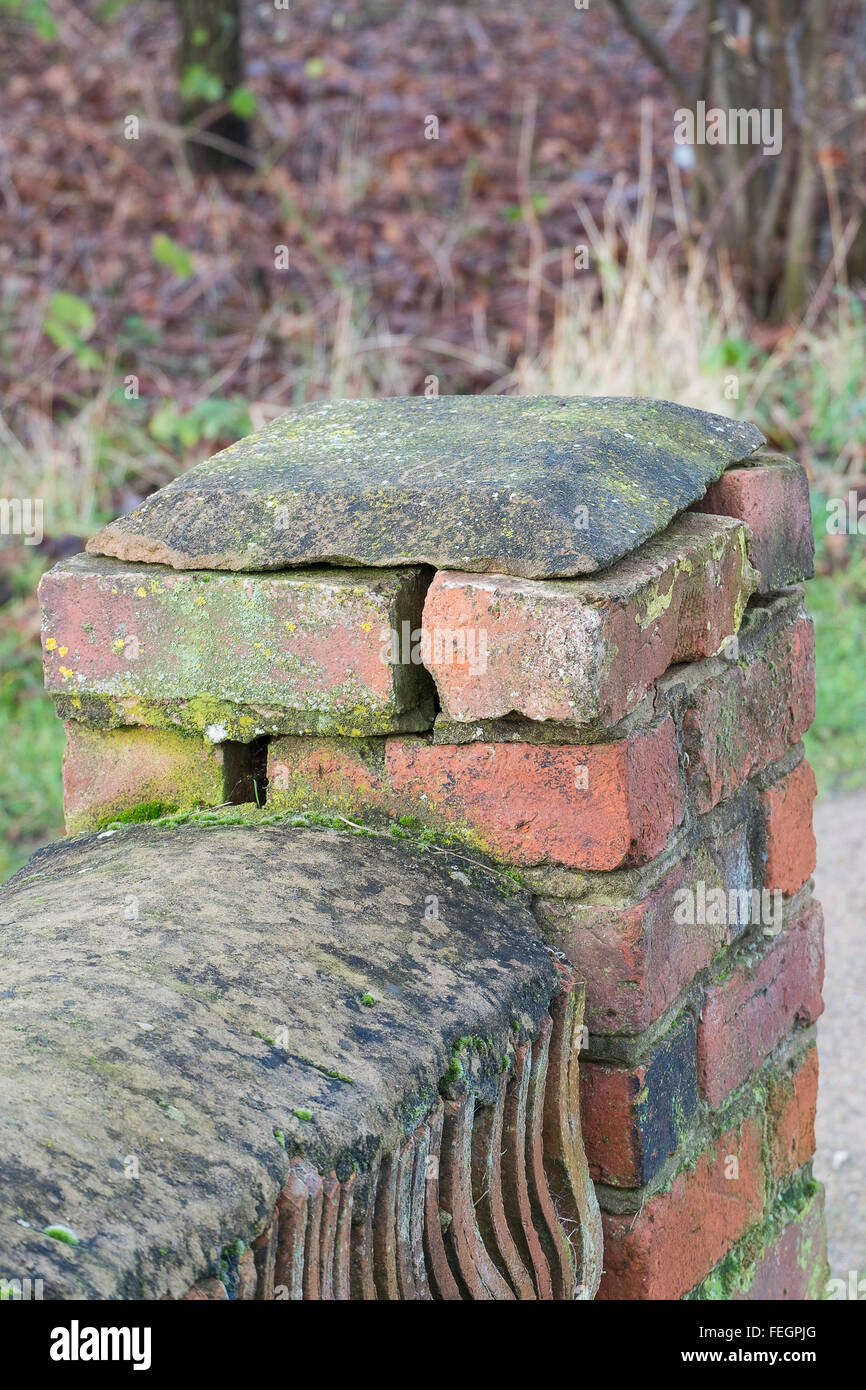 end of a weathered brick wall showing cracks and missing mortar Stock ...