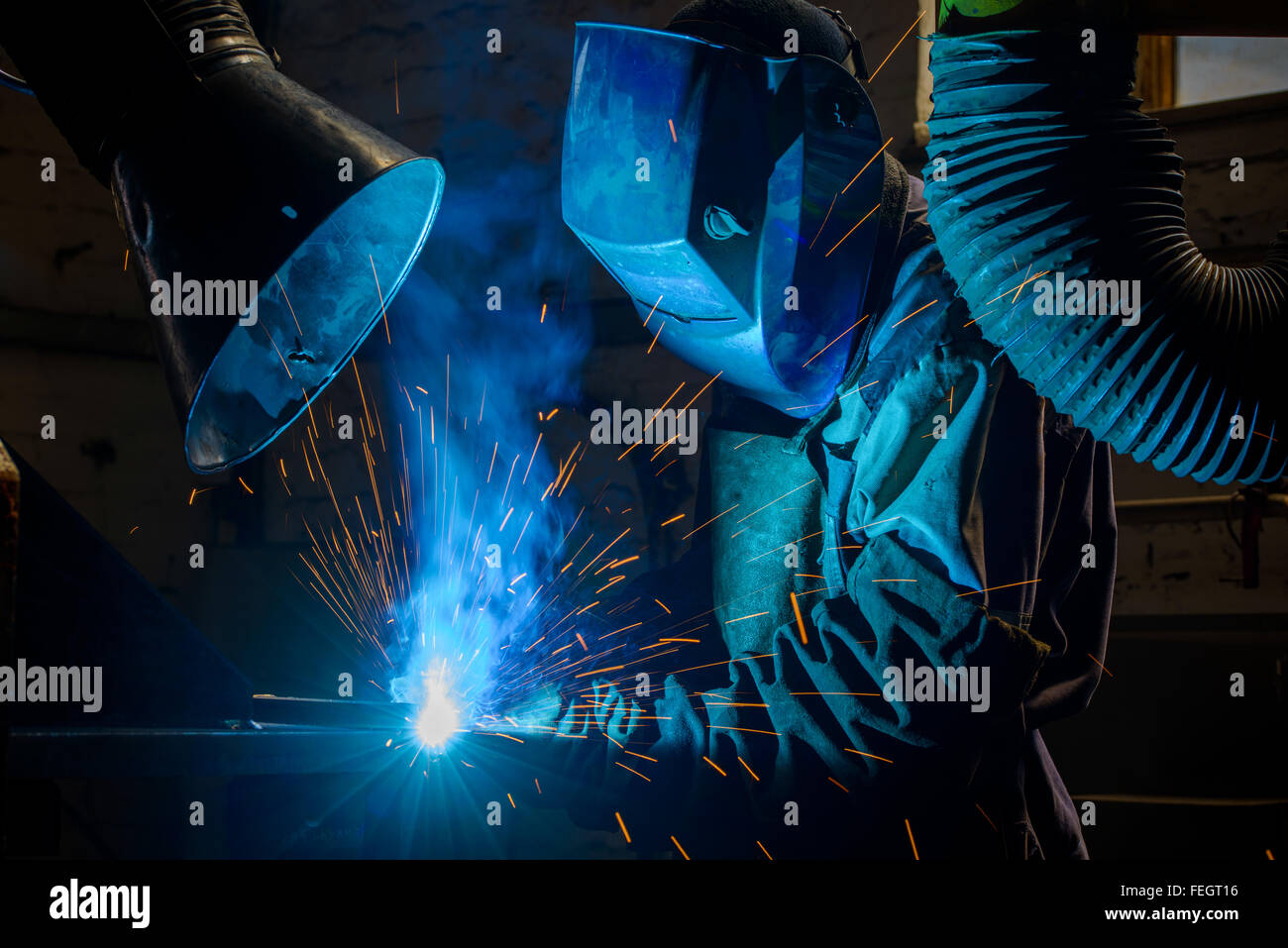 Welder with protective mask Stock Photo - Alamy