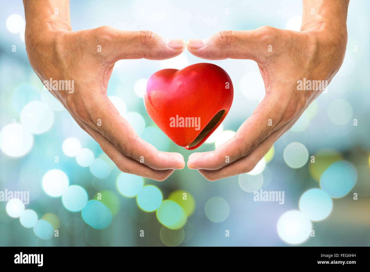 Making a heart shape with the hand symbol Stock Photo - Alamy