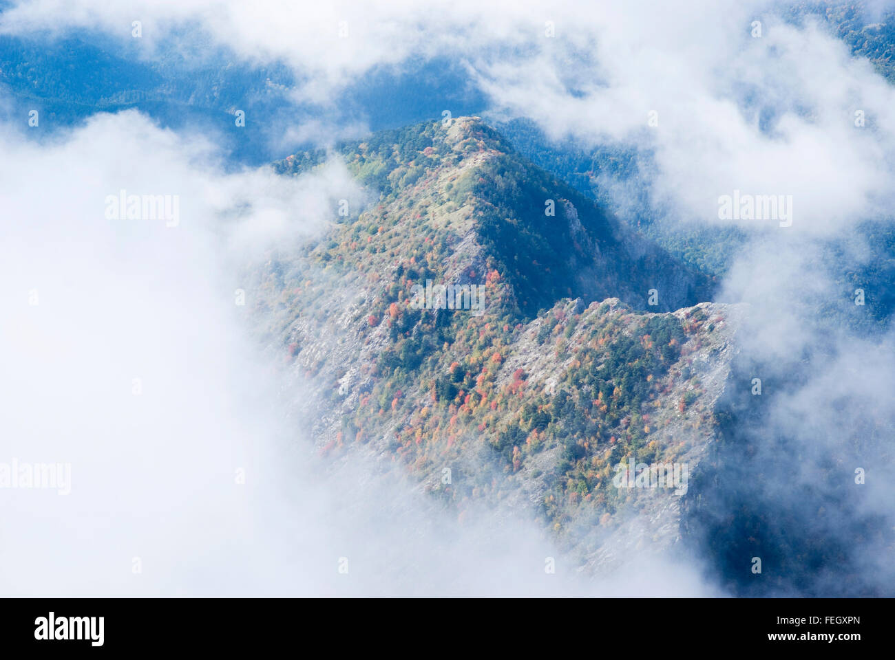 Italian Alps. Fog revealing the mountain range Stock Photo - Alamy