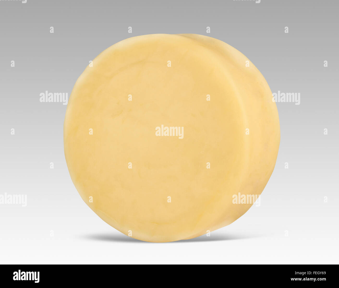 Round yellow cheese mockup with no label on grey background Stock Photo ...