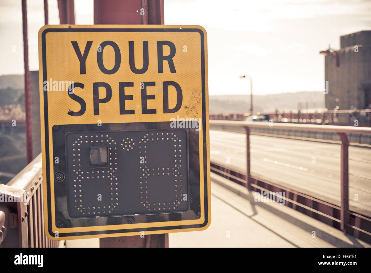 Your speed sign on the bridge in sepia style Stock Photo - Alamy