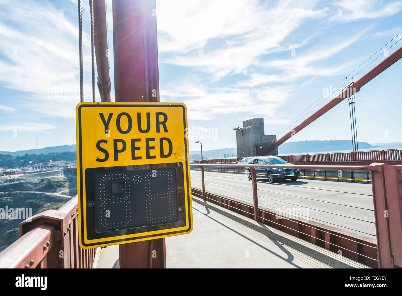 Your speed sign on the bridge with Lens burst flare Stock Photo - Alamy