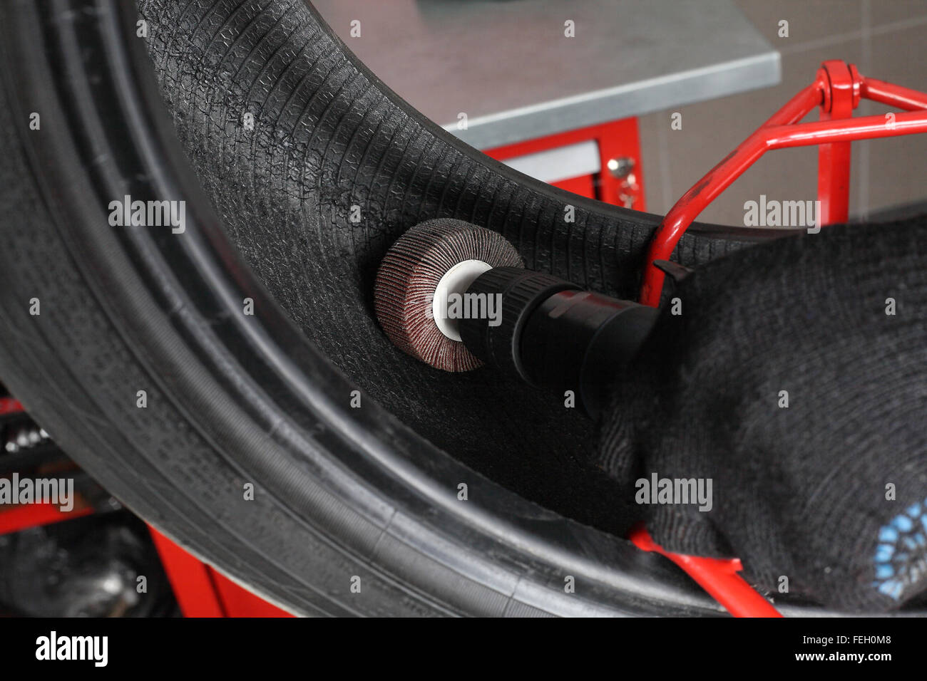 Car service: Tyre repair. The worker repair of tire - Vulcanization ...