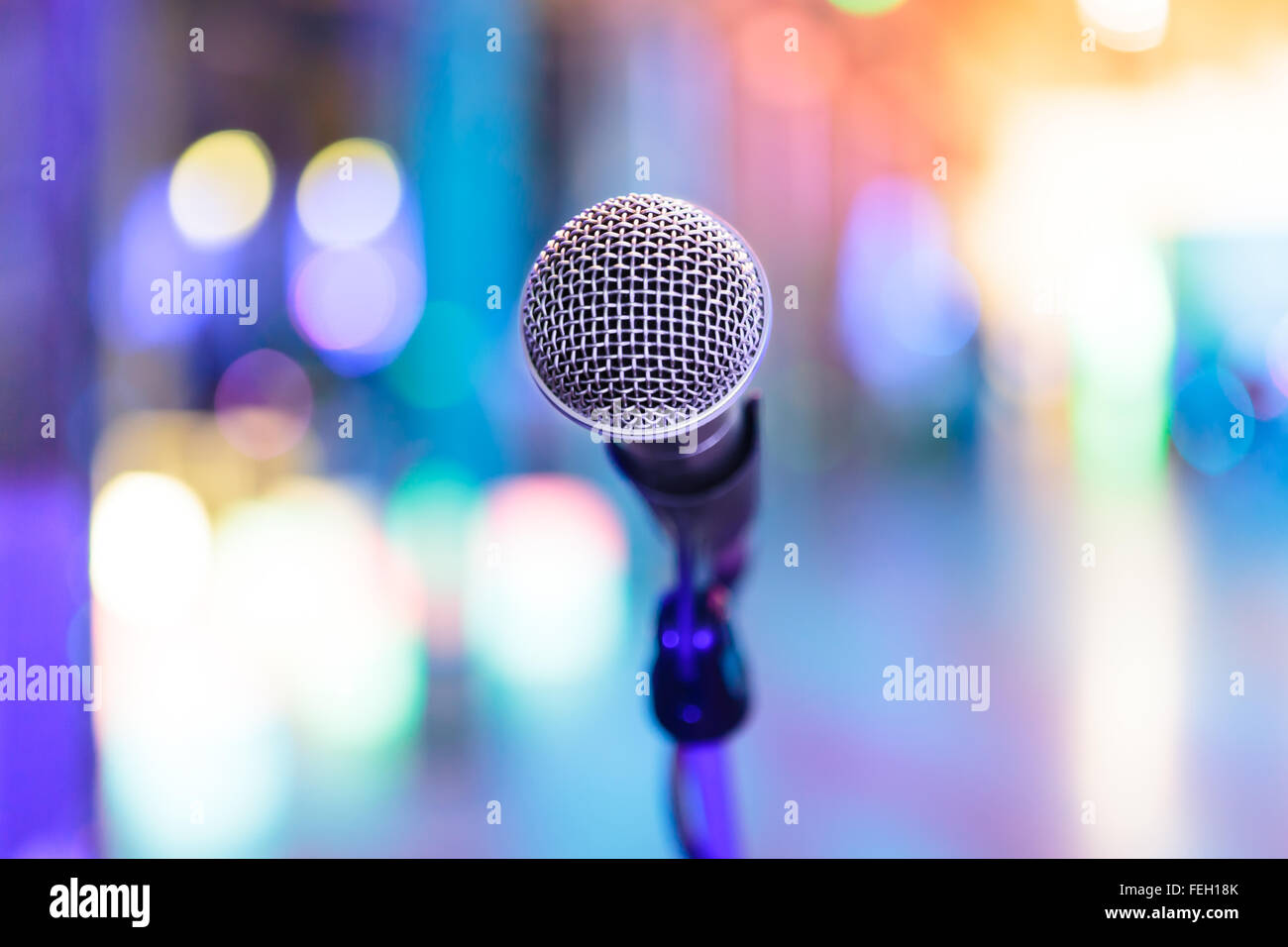 Detail of microphone with bright blurred party lights around Stock ...
