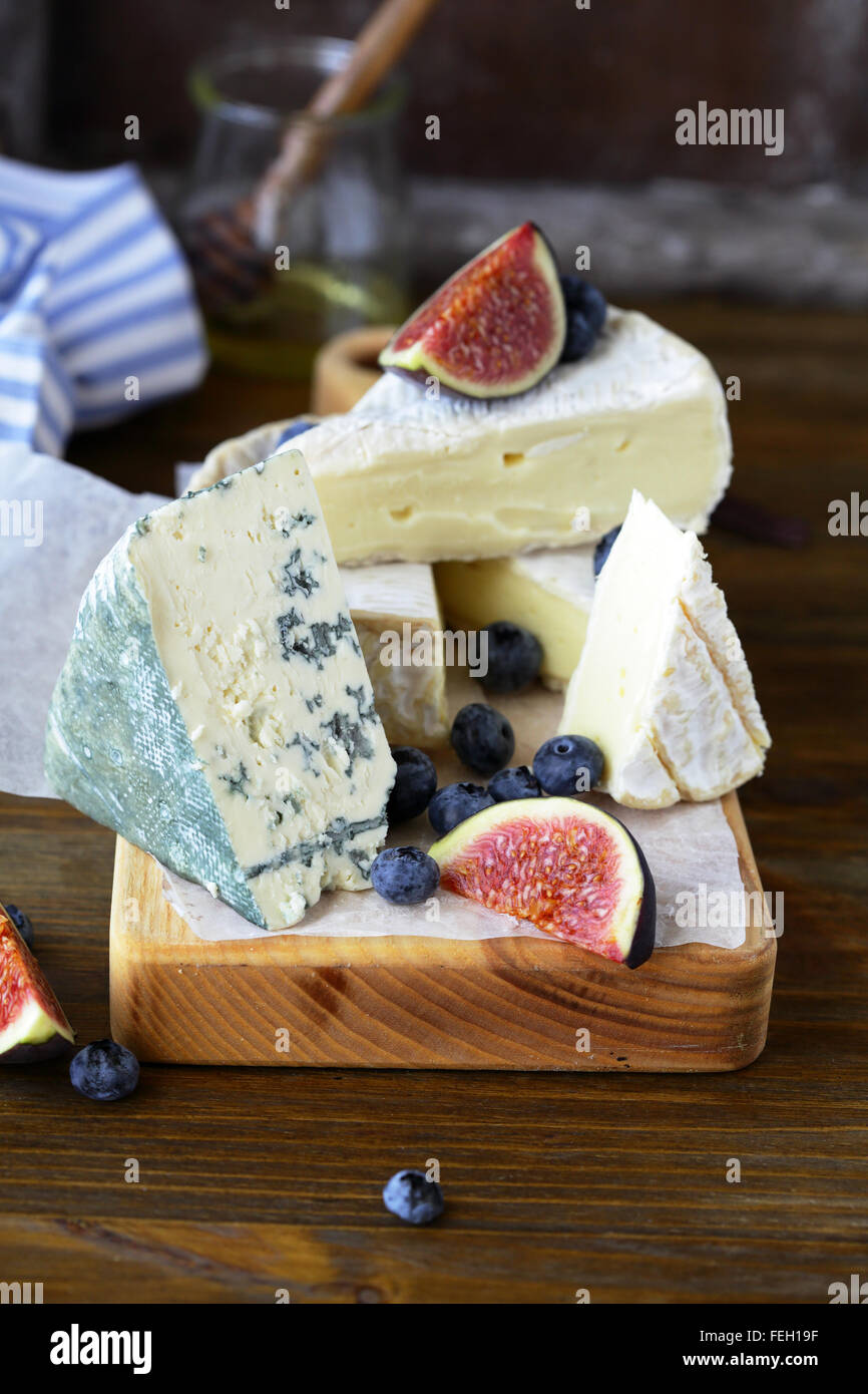 gourmet cheese mix on board, food closeup Stock Photo - Alamy