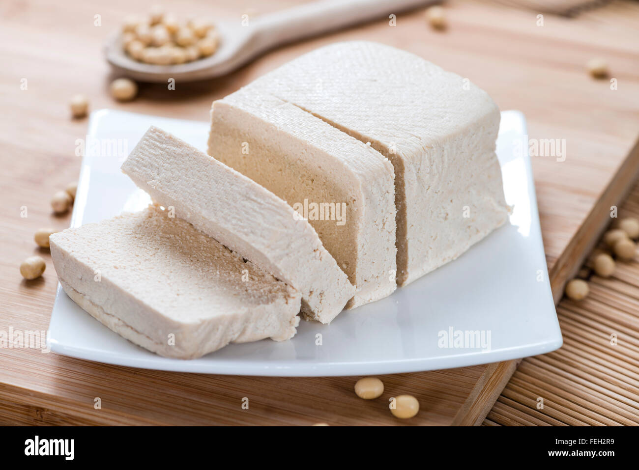 Portion of Tofu (detailed close-up shot) on wooden background Stock ...