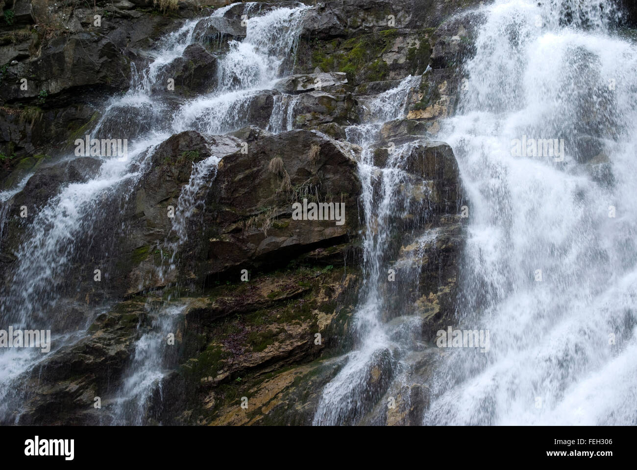 Waterfall in the Alps mountains Stock Photo - Alamy