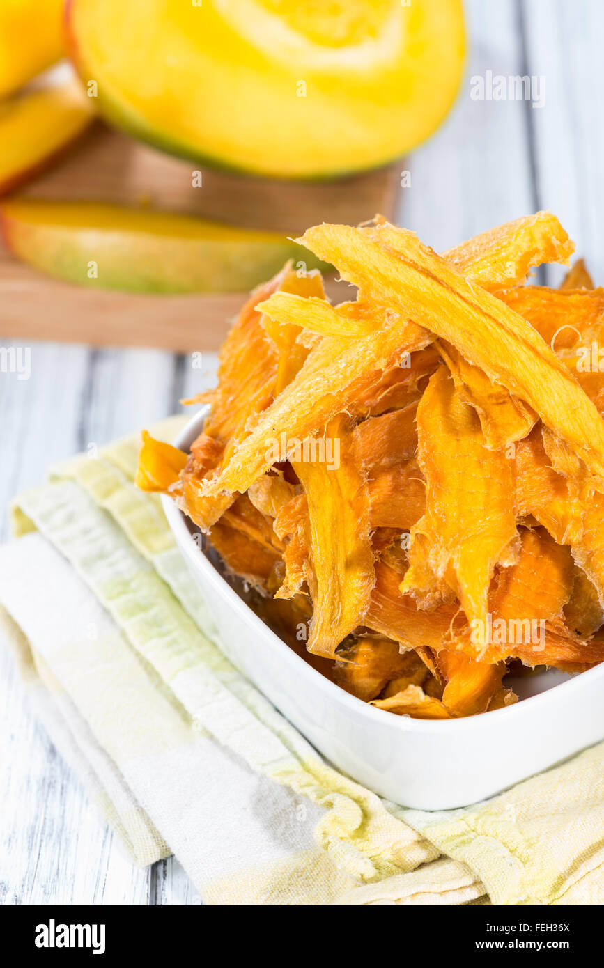 Dried Mango slices in a bowl (close-up shot Stock Photo - Alamy