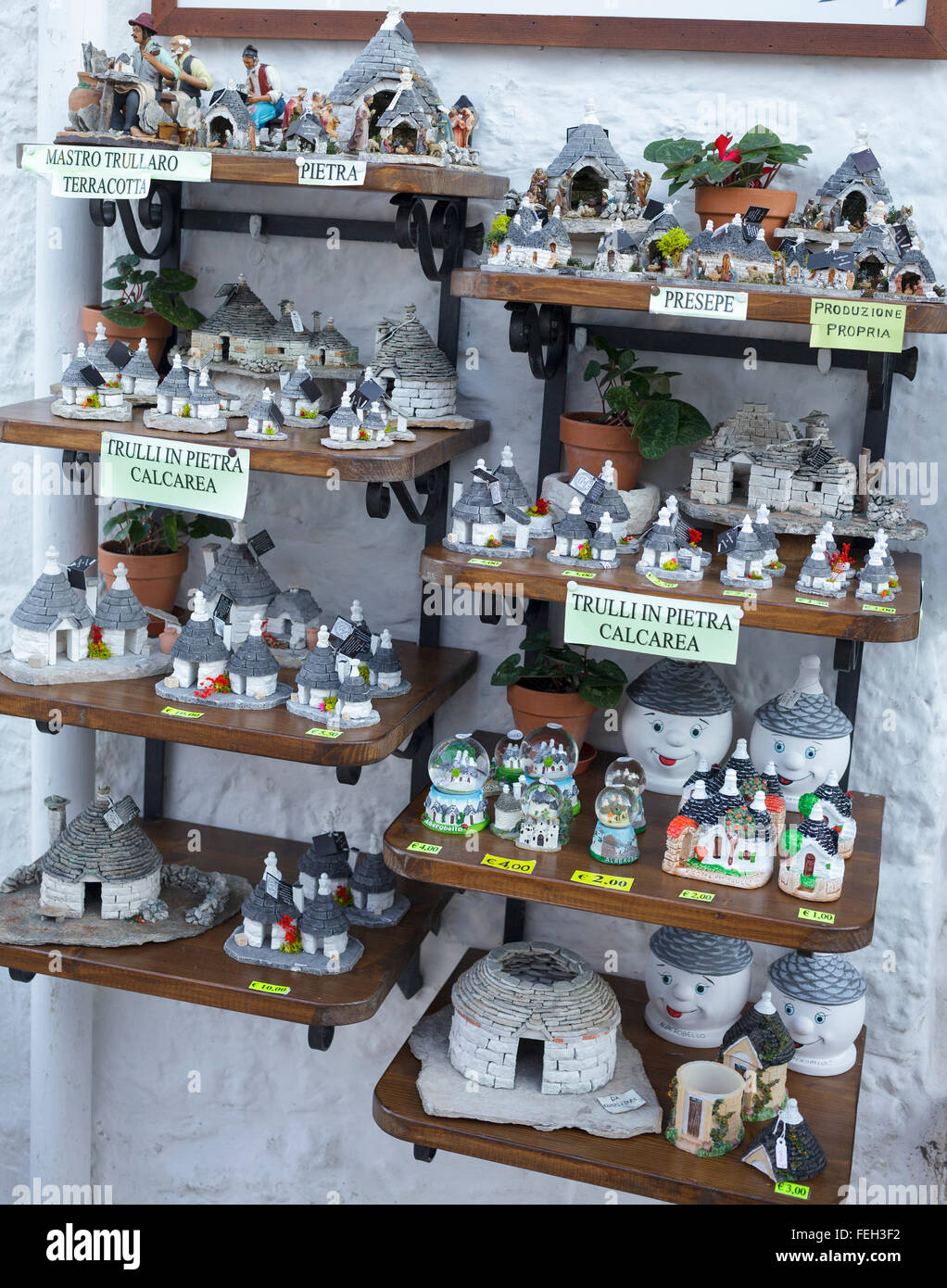 Miniature trulli souvenirs outside a shop in Alberobello, Puglia, Italy ...