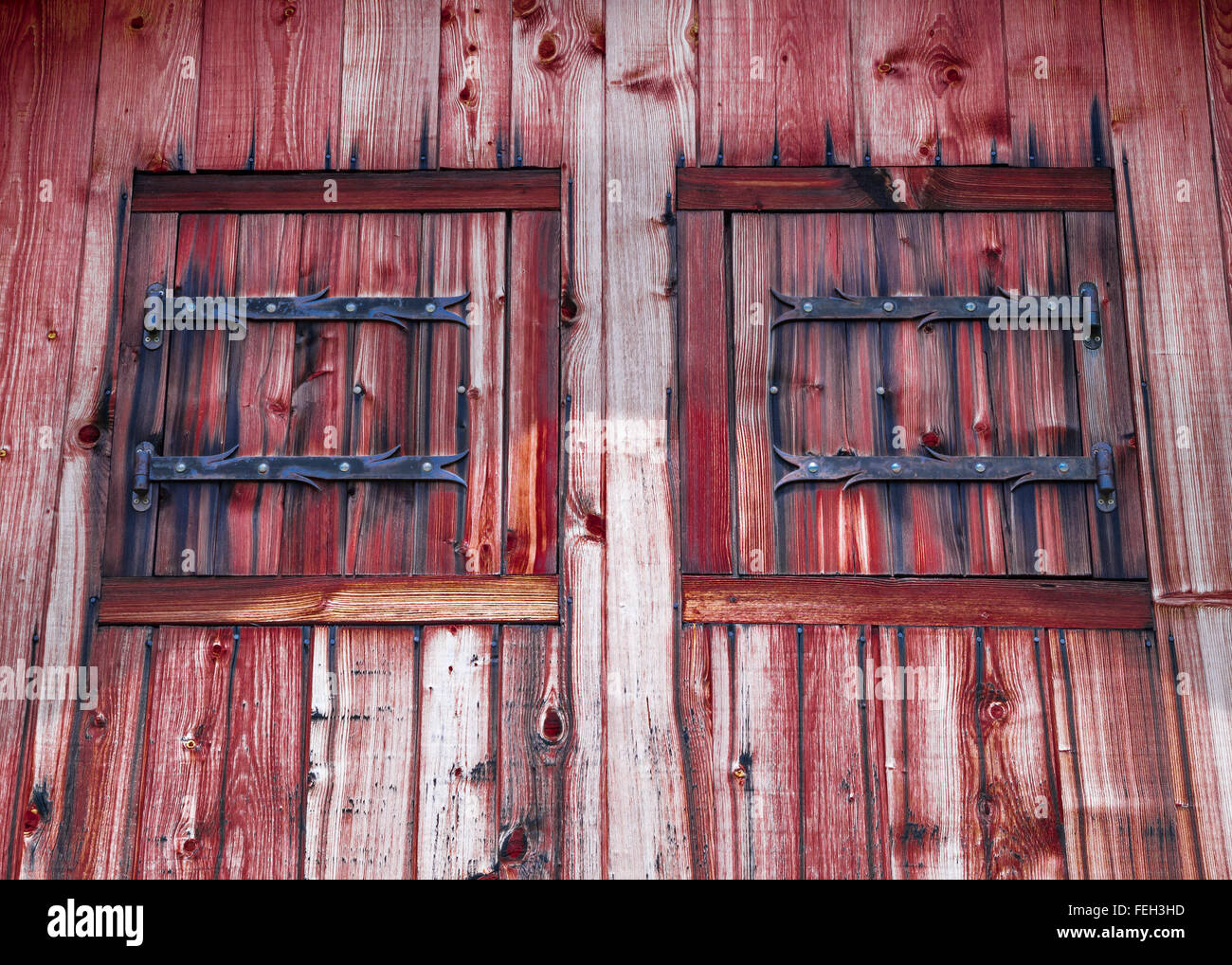 Rustic facade of a wooden house with wooden shutters. Typical facade ...