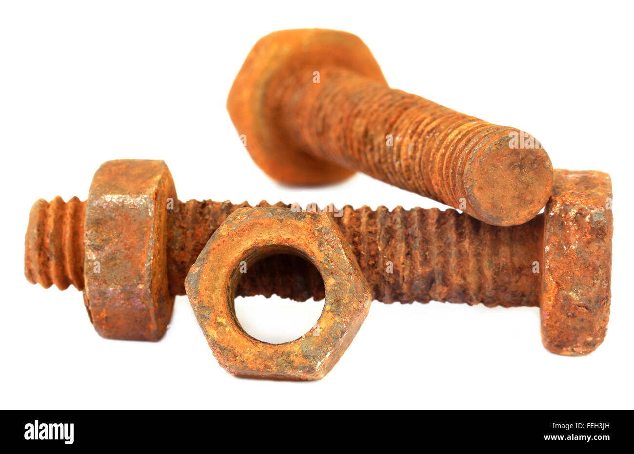 Rusty bolts with nuts over white background Stock Photo - Alamy