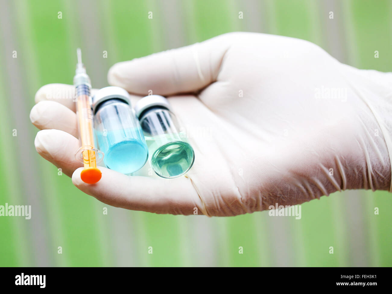 Glass syringe hand hi-res stock photography and images - Alamy
