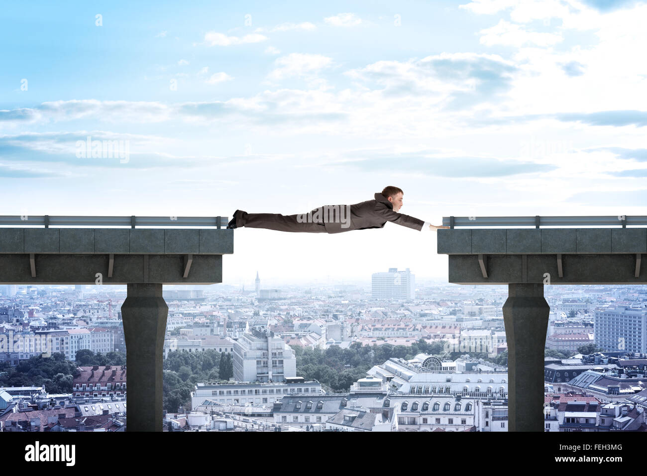 Businessman linking broken bridge Stock Photo - Alamy Businessman linking broken bridge Stock Photo - Alamy